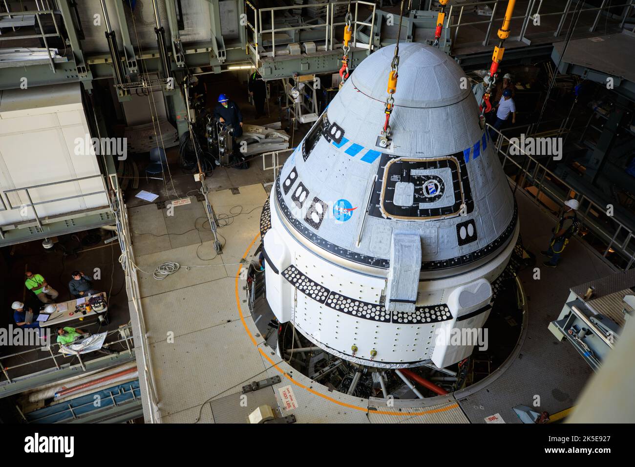 The Boeing CST-100 Starliner spacecraft is lifted at the Vertical ...