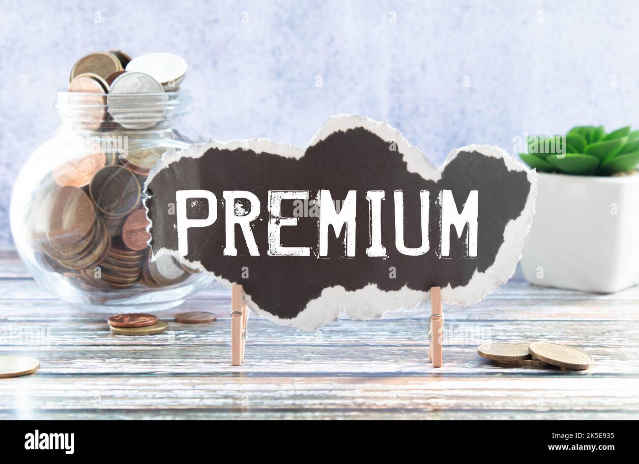 INSURANCE PREMIUM words on clipboard, with calculator, magnifier and ...