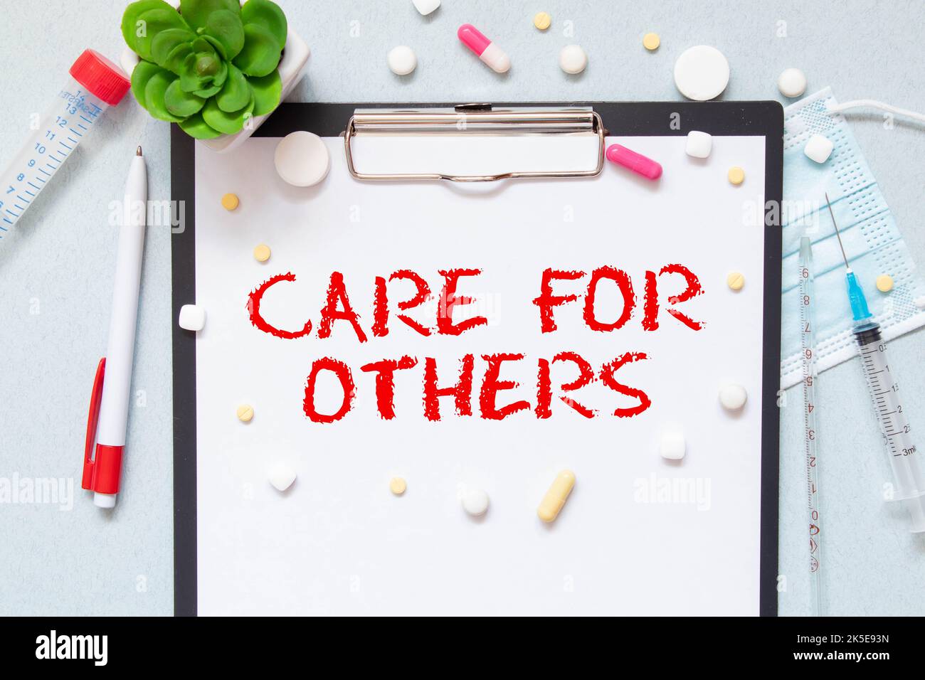 blue file folder with the text CARE FOR OTHERS. Medical concept Stock ...