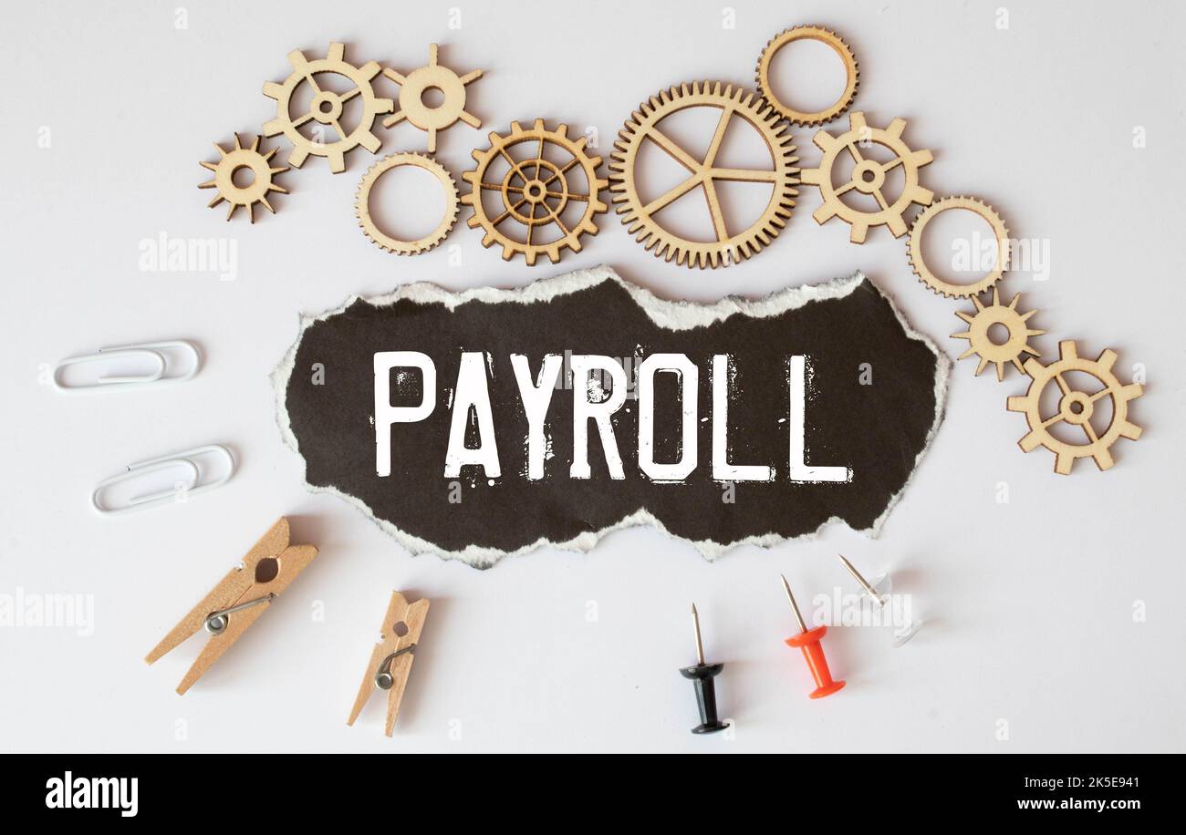 White paper with text PAYROLL isolated on blue background Stock Photo ...