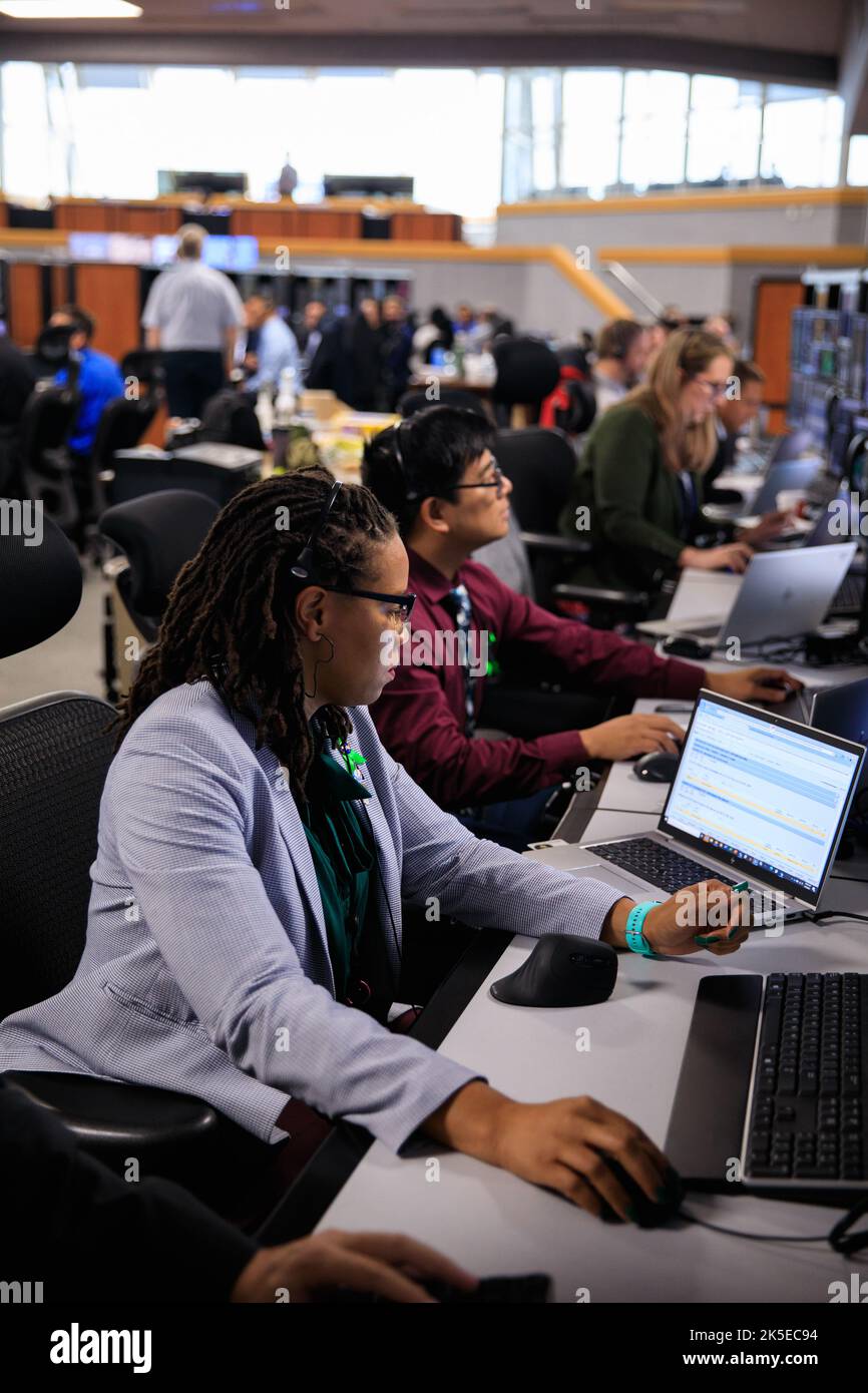 Members of the Artemis I launch team are at their consoles inside ...