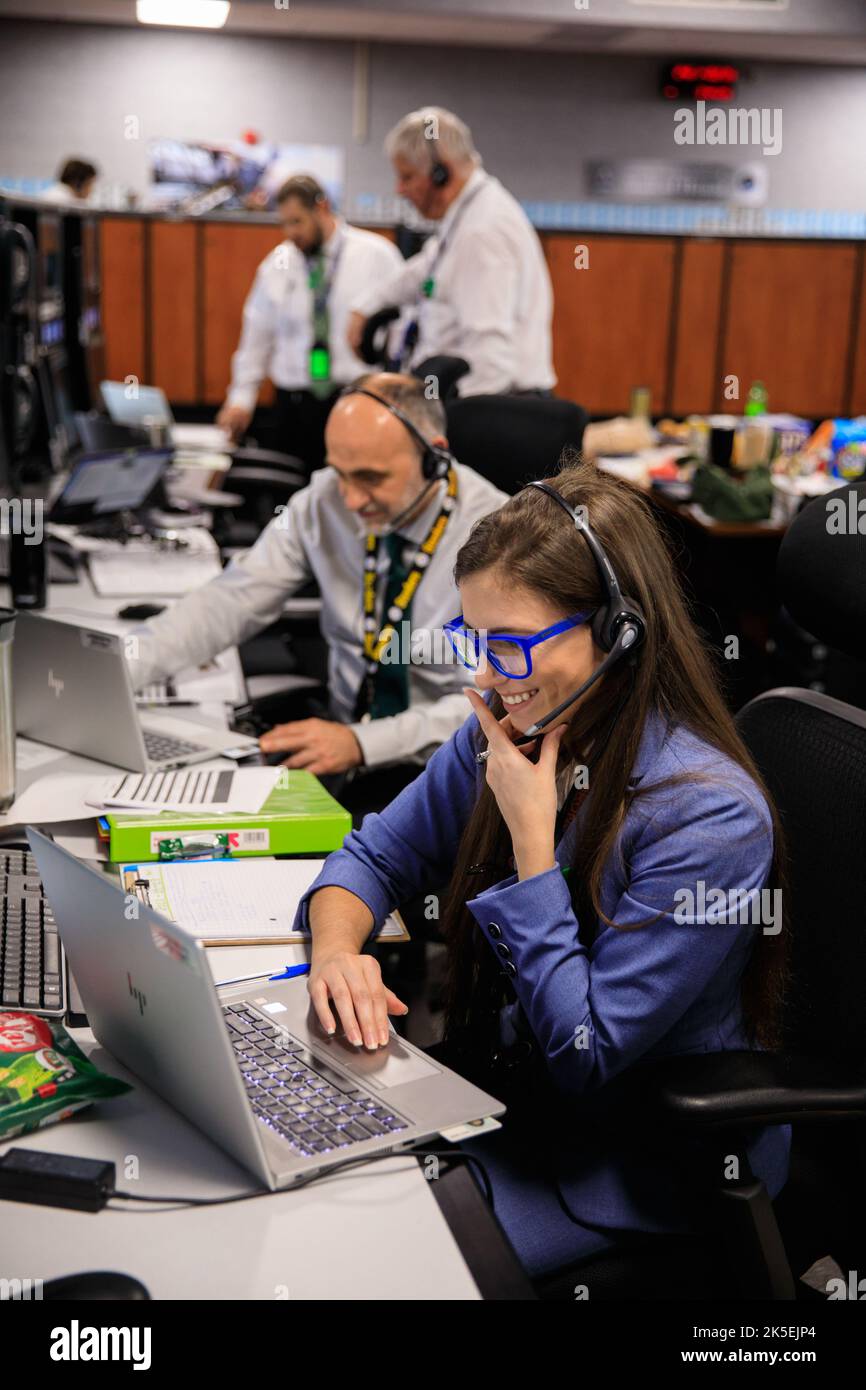 Members of the Artemis I launch team are at their consoles inside ...