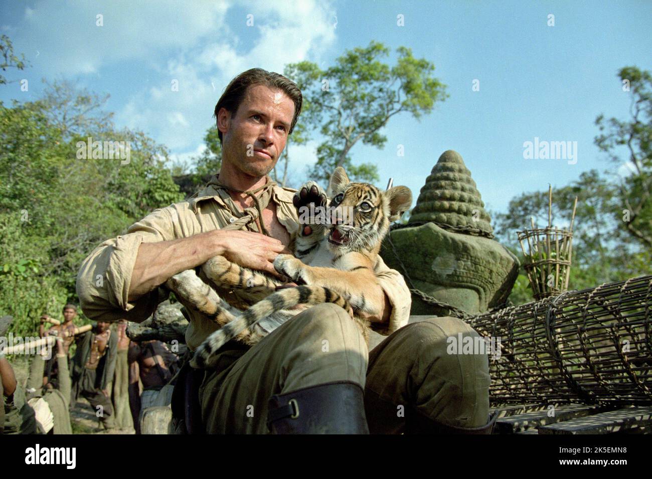 GUY PEARCE WITH TIGER CUB, TWO BROTHERS, 2004 Stock Photo - Alamy