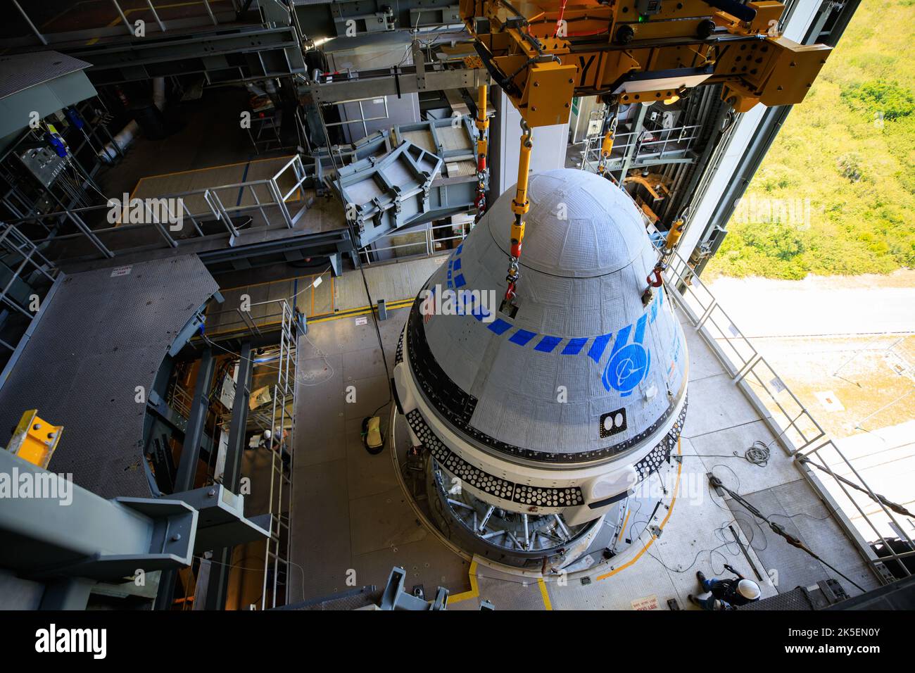 The Boeing CST-100 Starliner spacecraft is lifted at the Vertical ...