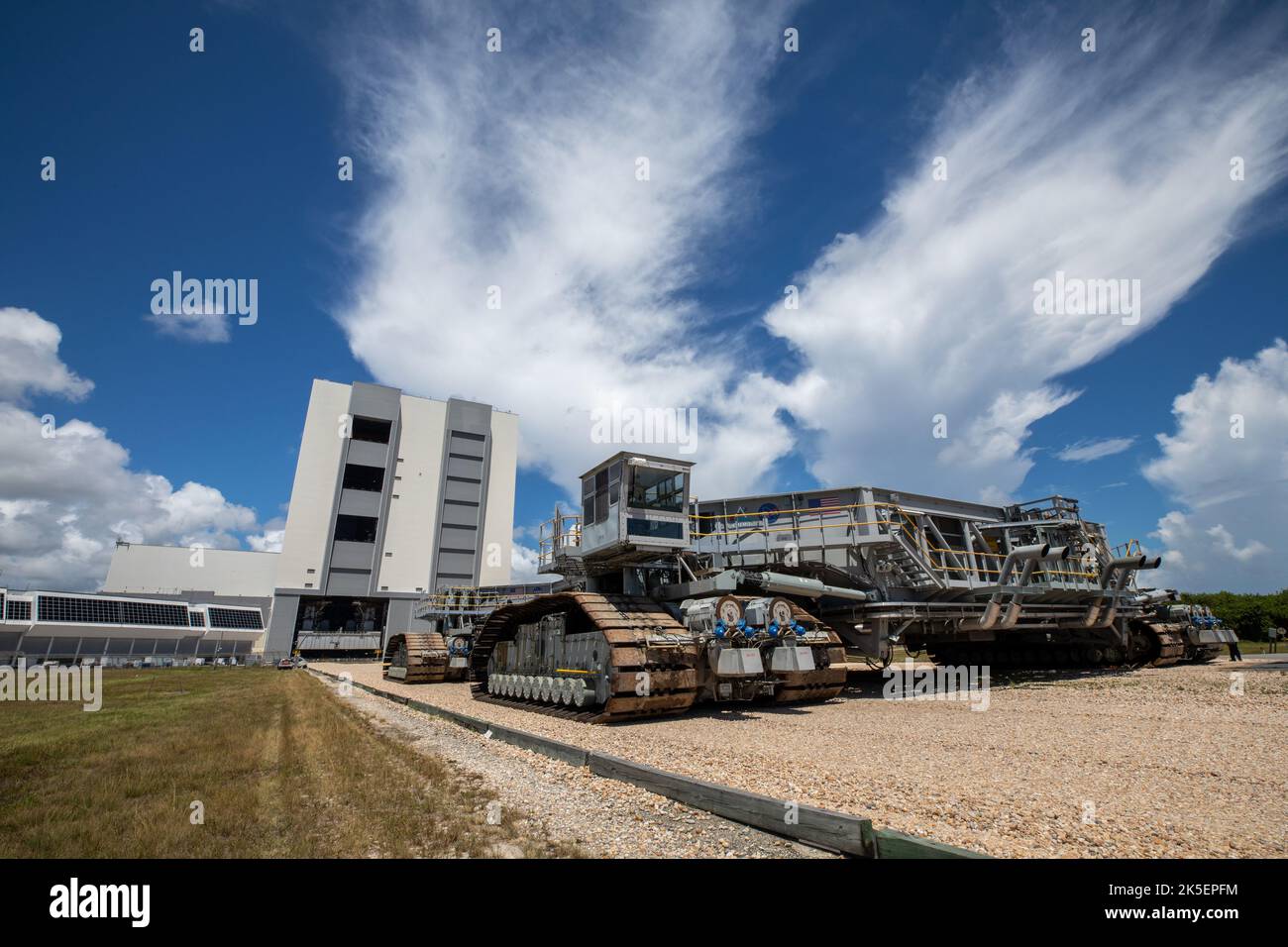 The crawler-transporter, driven by engineers, approaches the Vehicle ...