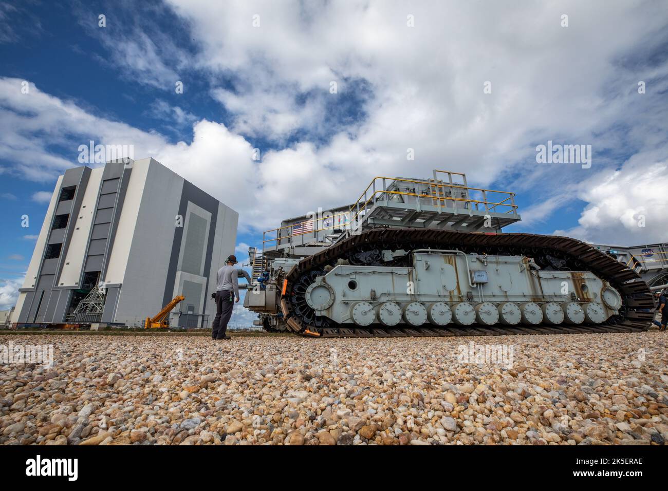 Technicians check equipment on crawler-transporter 2 during its trip to ...
