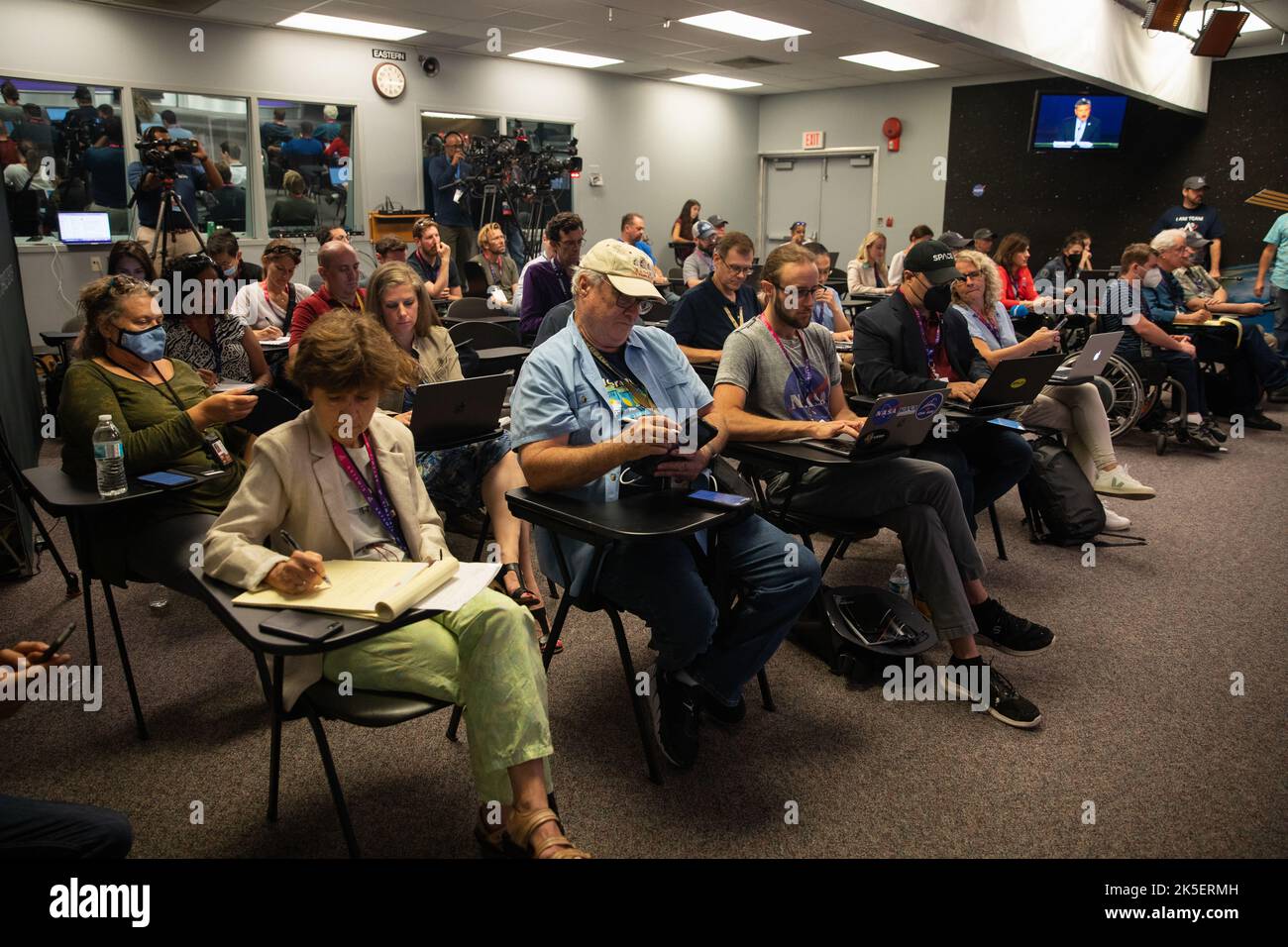 Members of the media attend an Artemis I mission status press briefing ...