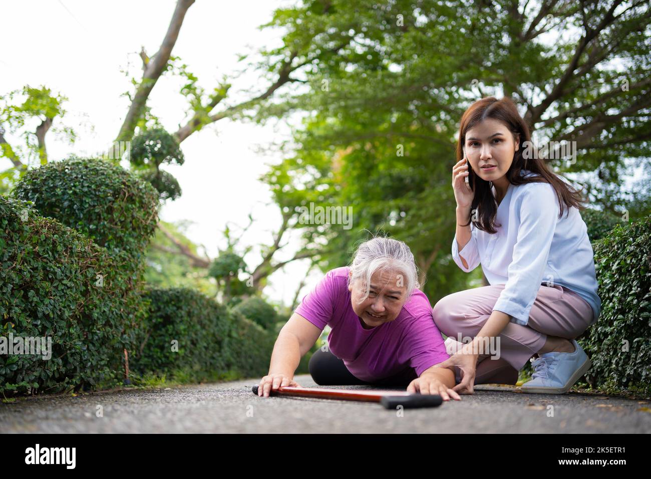 Asian senior woman fell down on lying floor because faint and limb ...