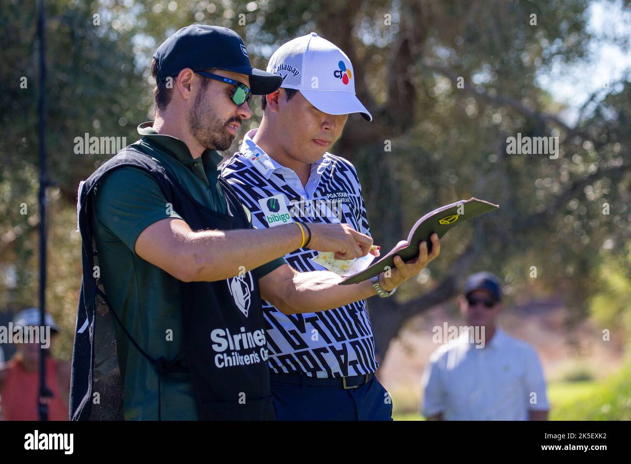 LAS VEGAS, NV - OCTOBER 06: Si Woo Kim checks the yardage with his ...