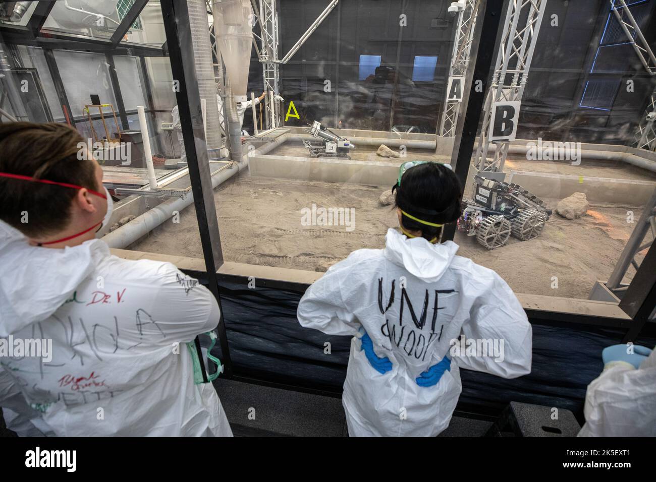 Team members from the University of North Florida watch their robotic ...