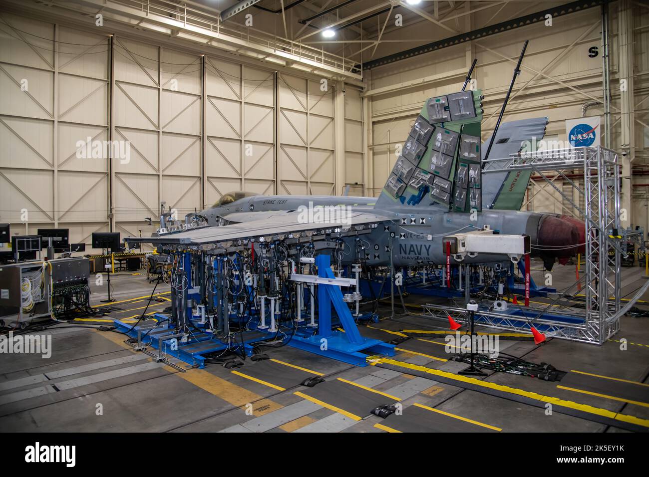 This rear view of the left wing load hardware shows the setup for ...