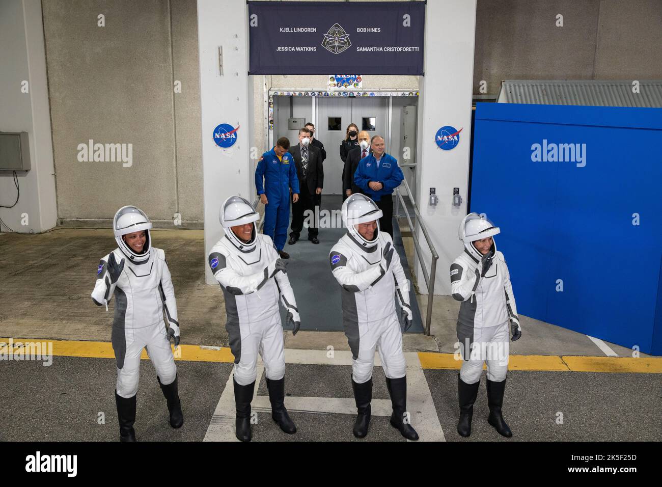 Crew-4 astronauts wave after walking out through the double doors below ...