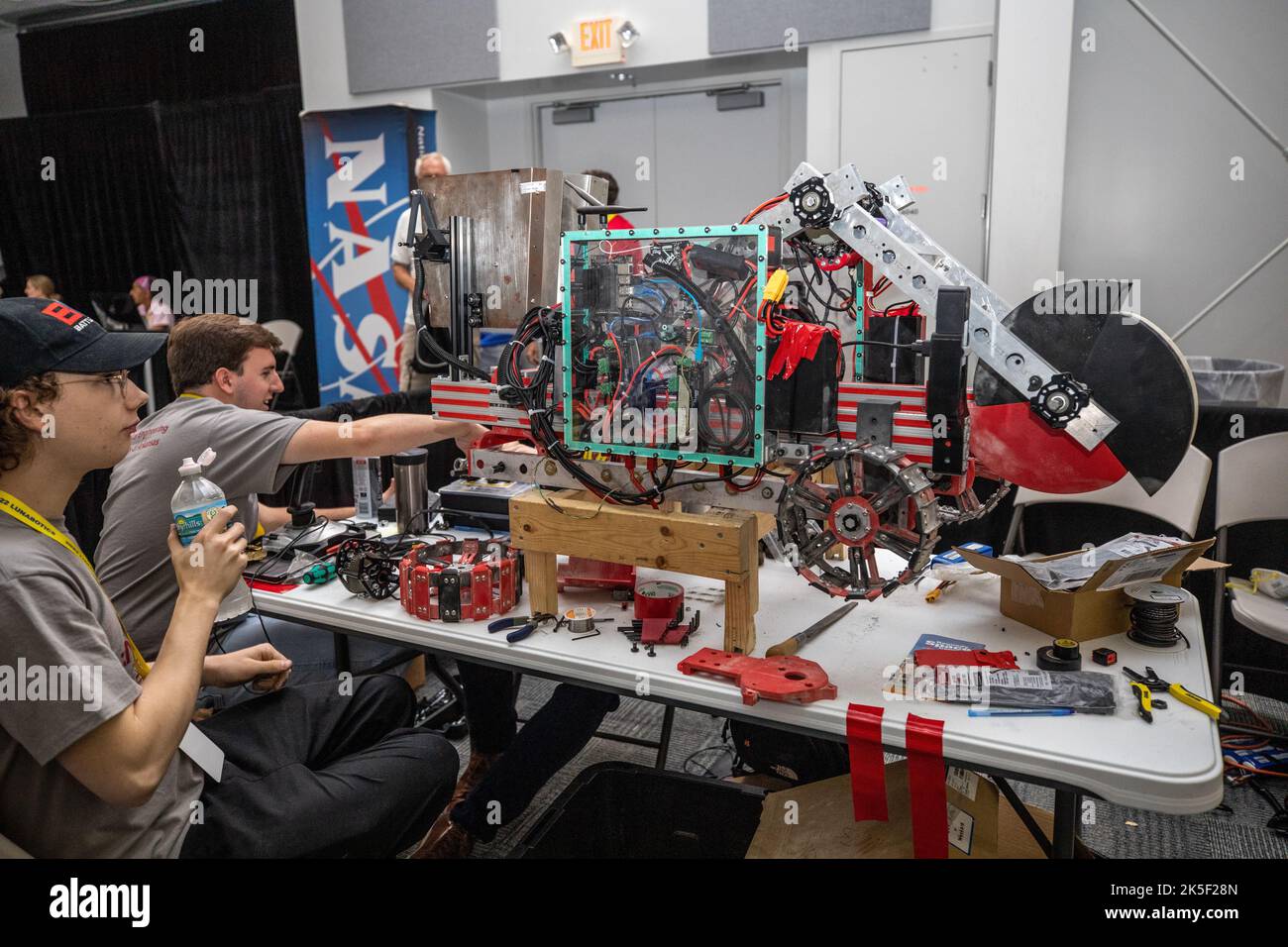 Students from the University of Arkansas prepare their robot for its ...