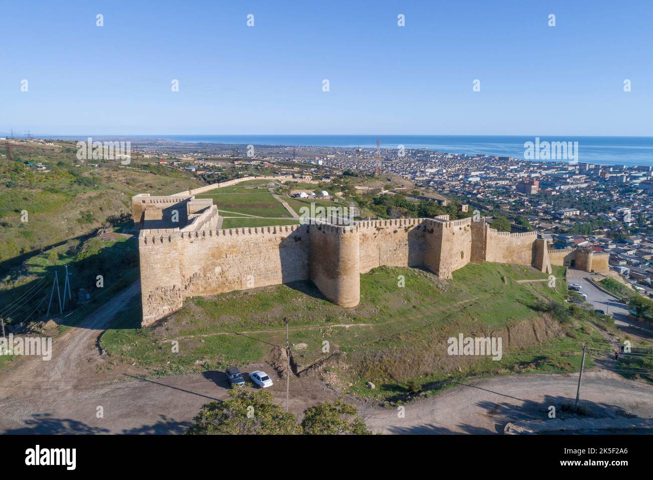 The ancient Naryn-Kala fortress against the backdrop of modern Derbent ...