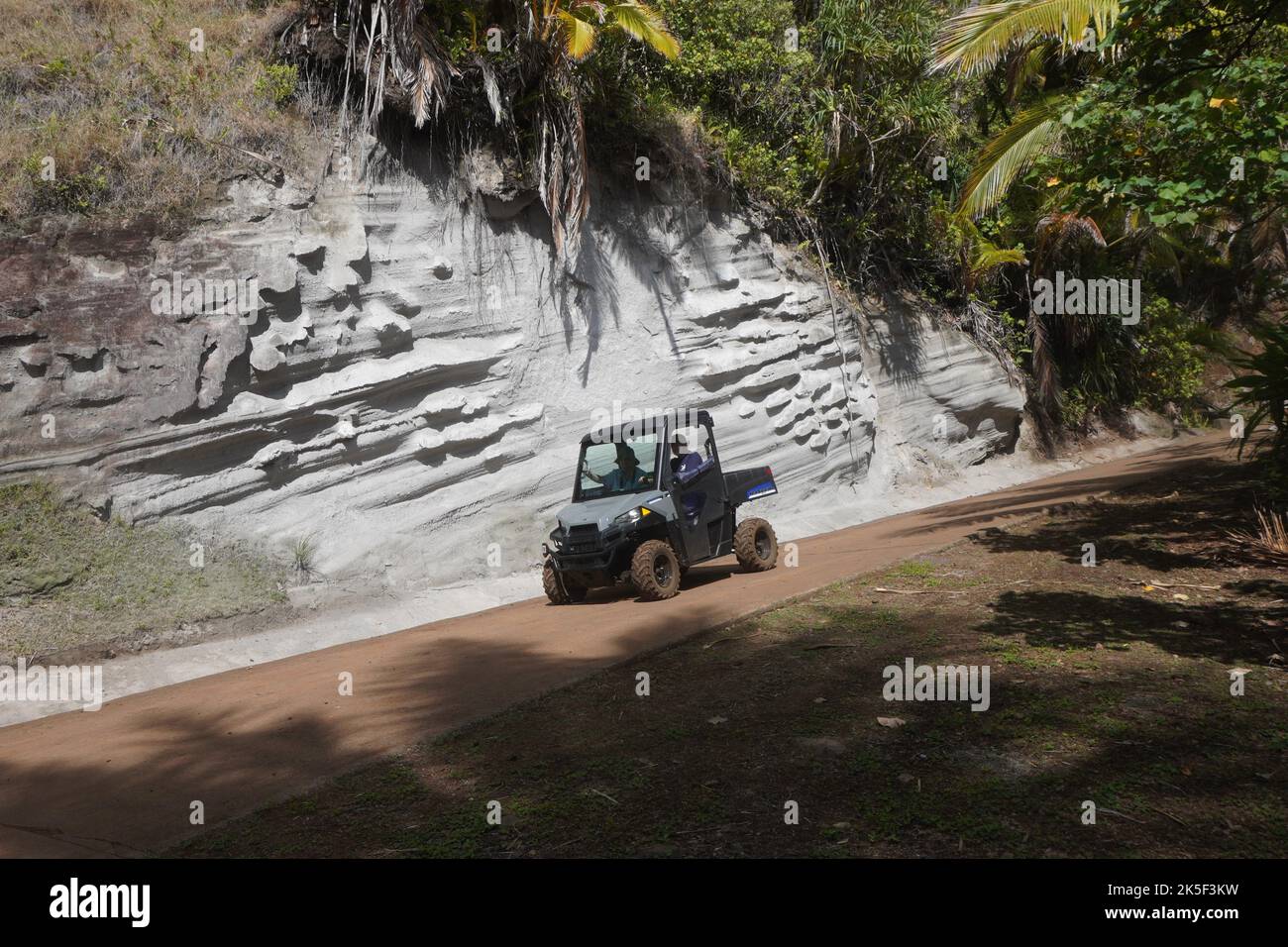 Ranger EV passing a peculiar Rock Wall Stock Photo - Alamy