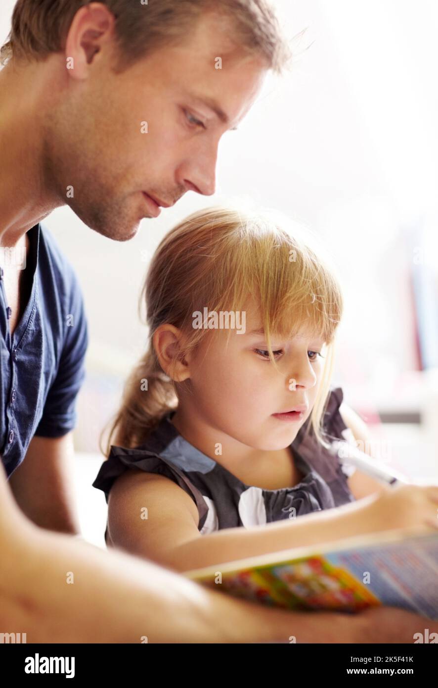 Father-daughter bonding. a young father bonding with his little ...