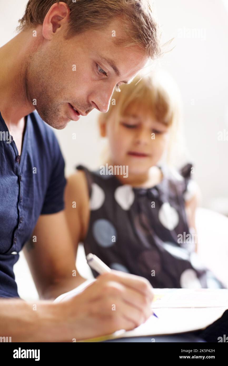Father-daughter bonding. a young father bonding with his little ...