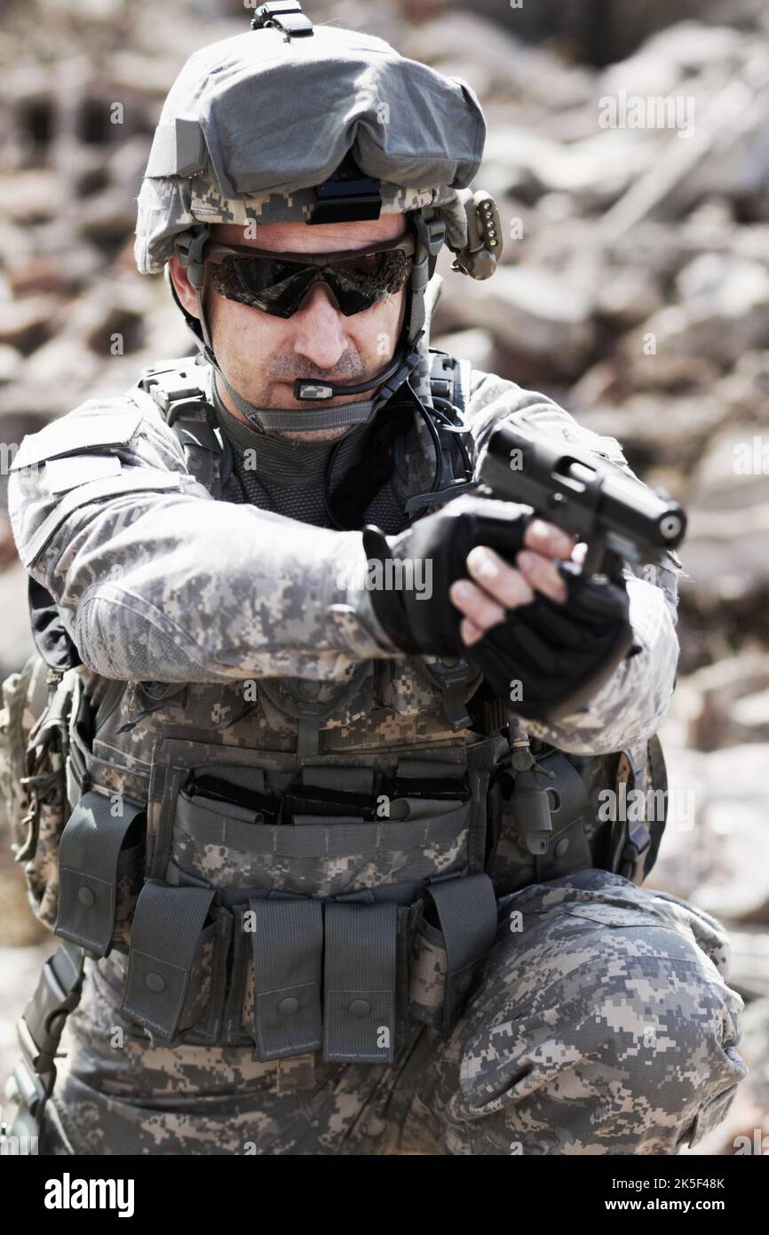 Hes part of the infantry. a military man aiming a handgun Stock Photo ...