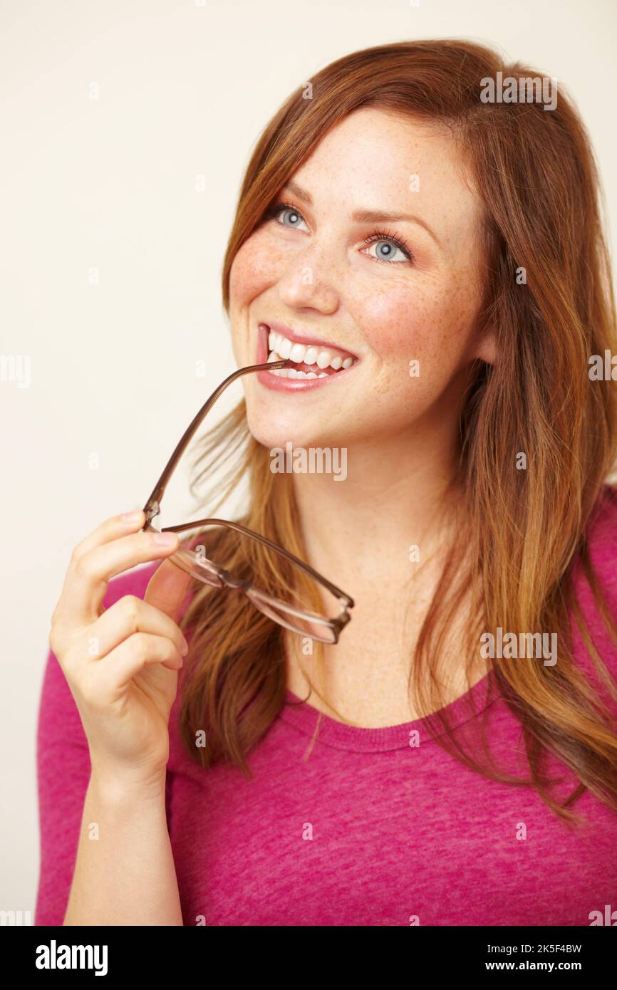 Ive got this figured out. Portrait of a beautiful young woman biting ...