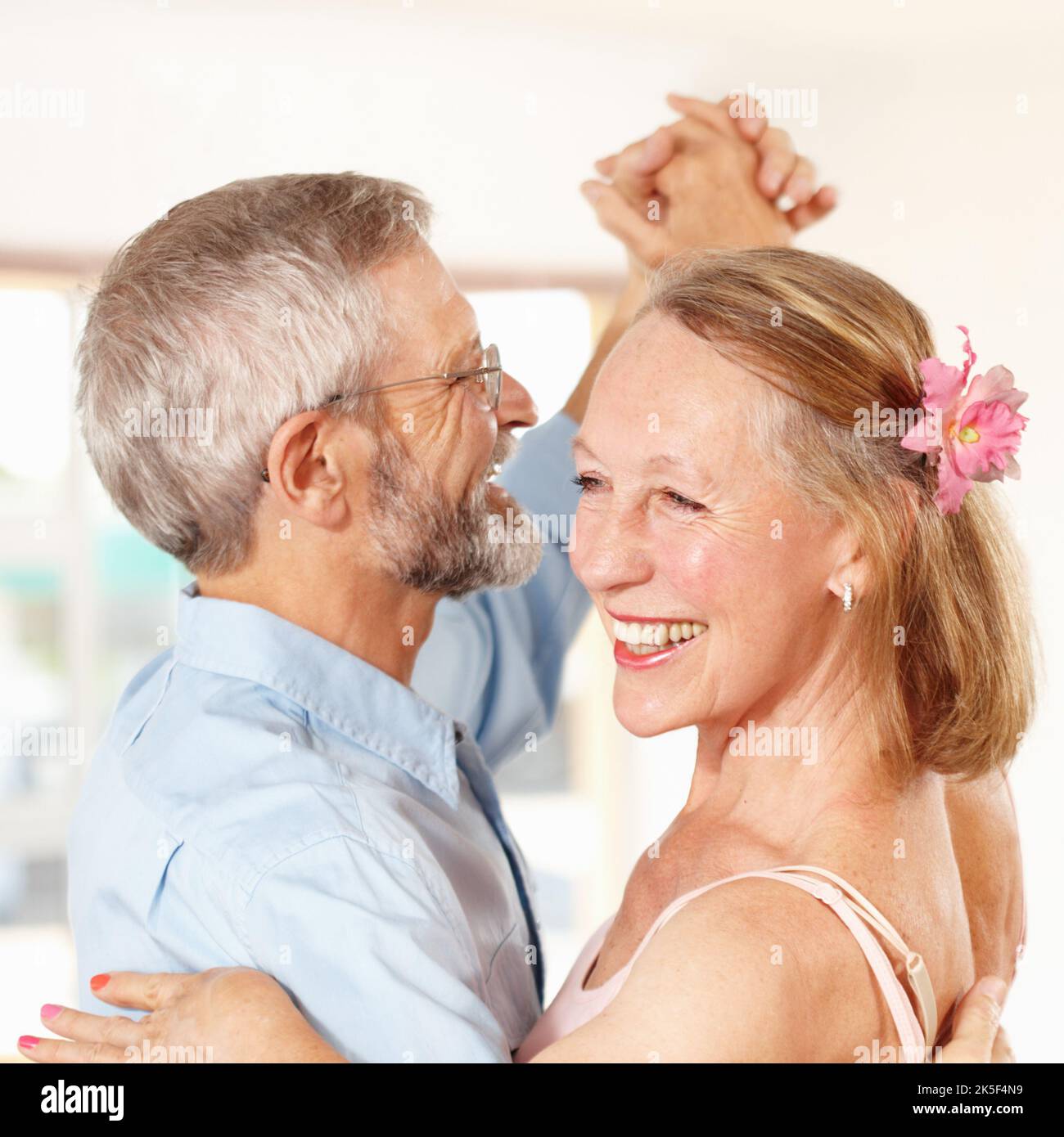 Were still perfect partners. a mature couple dancing joyfully with each ...