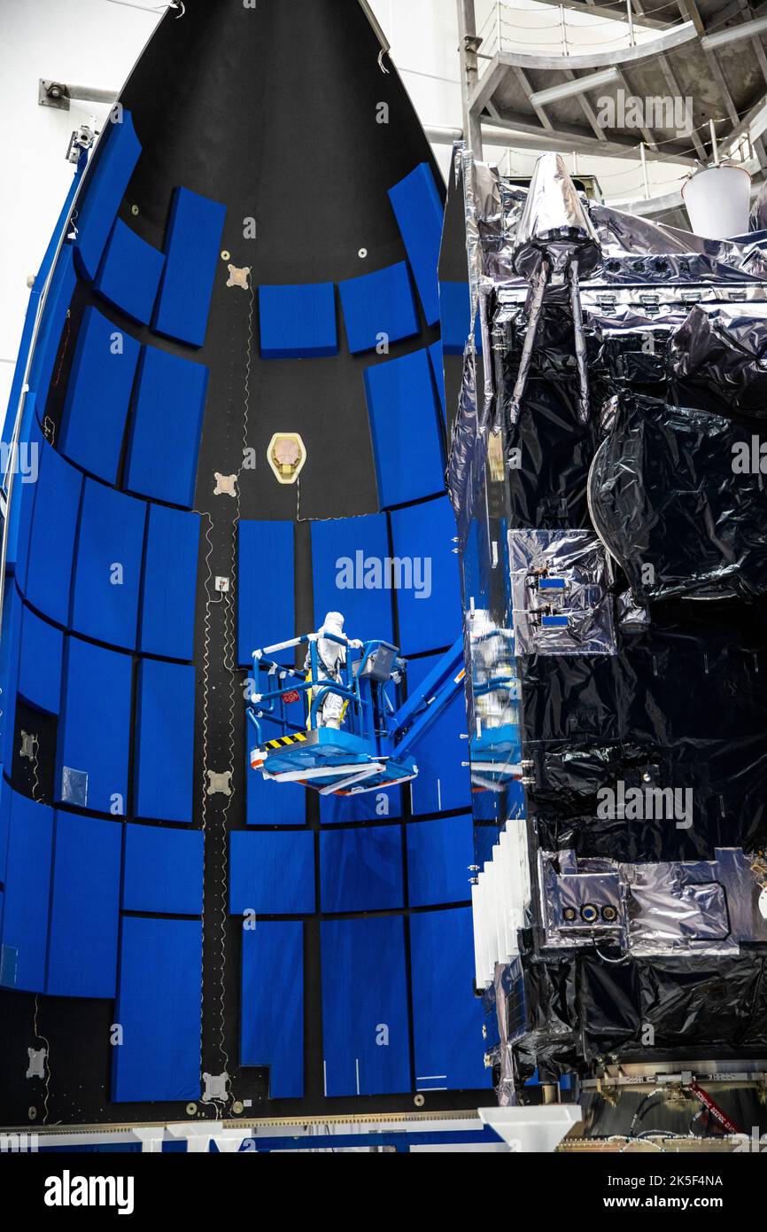 A technician inspects the first half of the United Launch Alliance ...