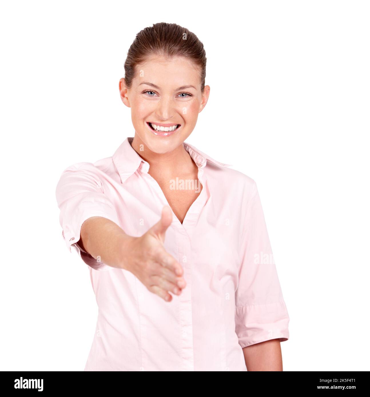 Welcome. A beautiful young woman offering you a handshake while ...