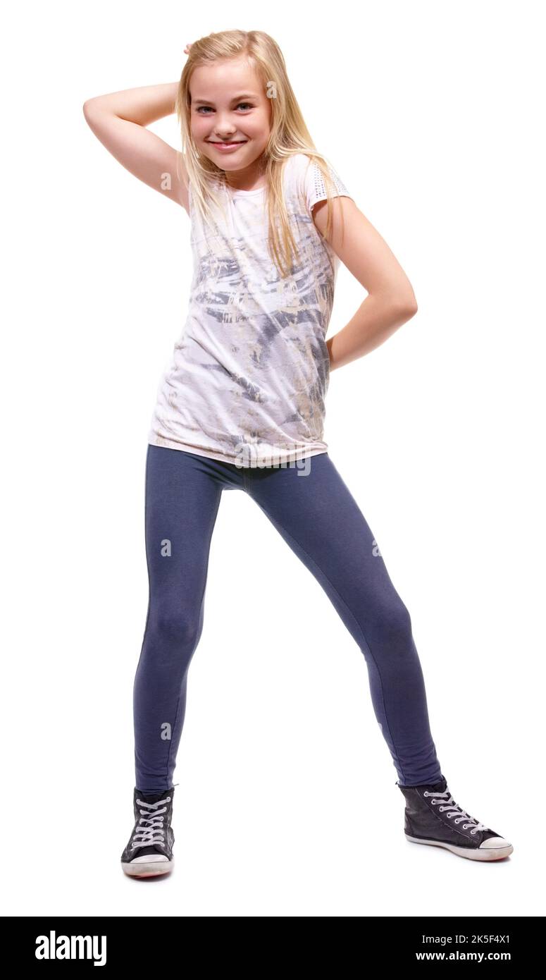 Get into the groove. Full length shot a young girl posing against white ...