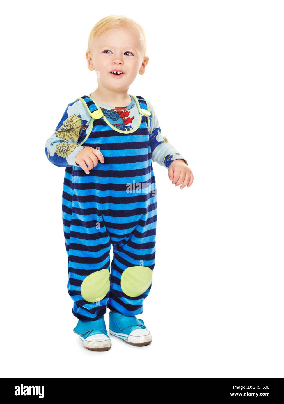 Curiosity at his new world. Cute little baby boy standing against a ...