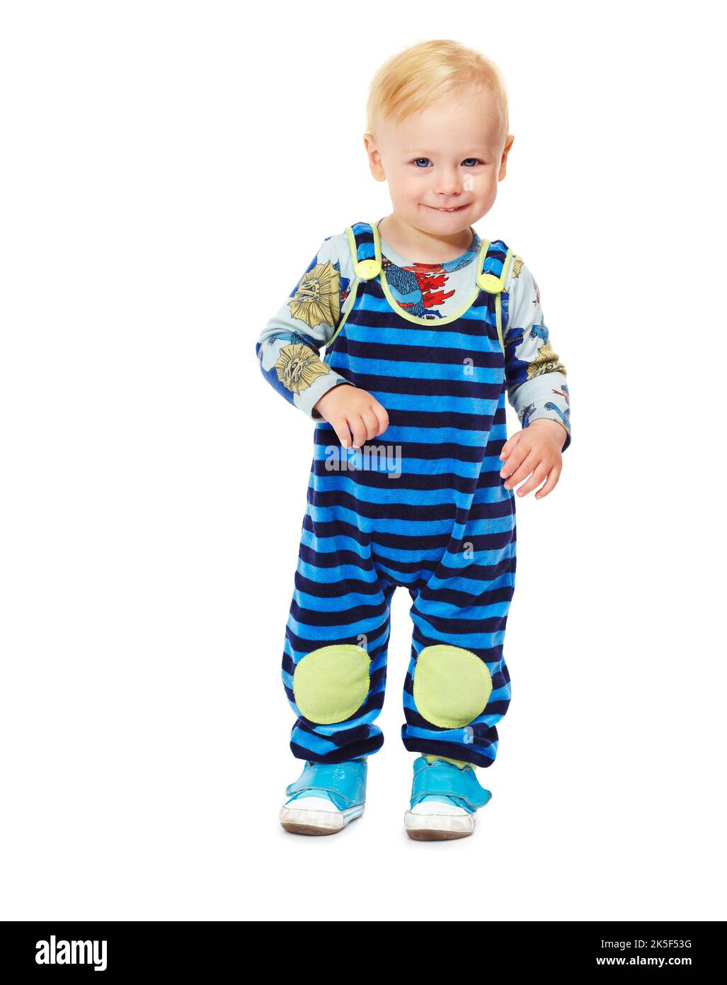 Too cute for words. Cute little baby boy standing against a white ...