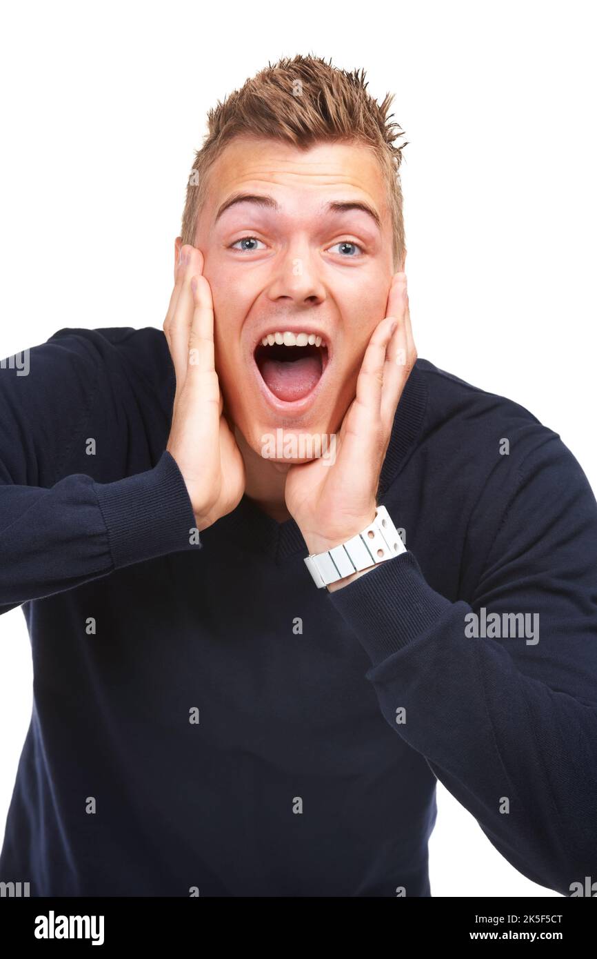 Wow Thats awesome. Studio portrait of an excited young guy yelling in ...