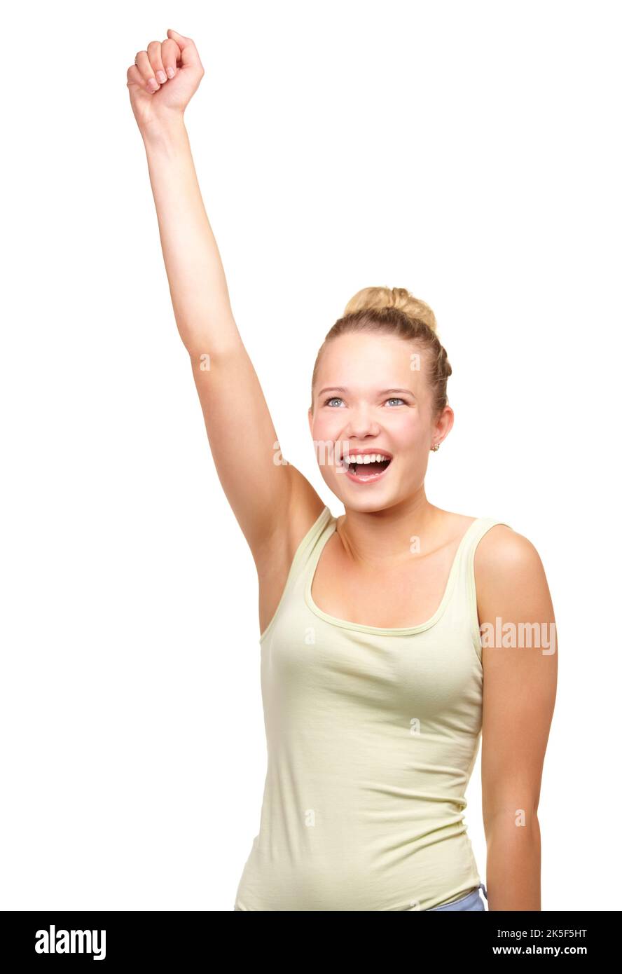 Go team. A pretty teenage girl standing with one hand in the air in a ...