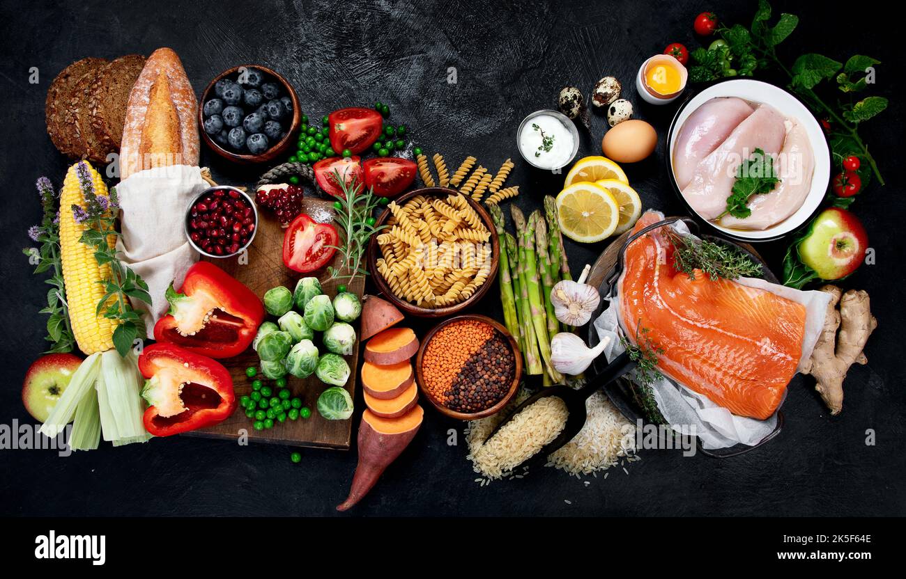 Healthy food selection on dark background. Detox and clean diet concept ...