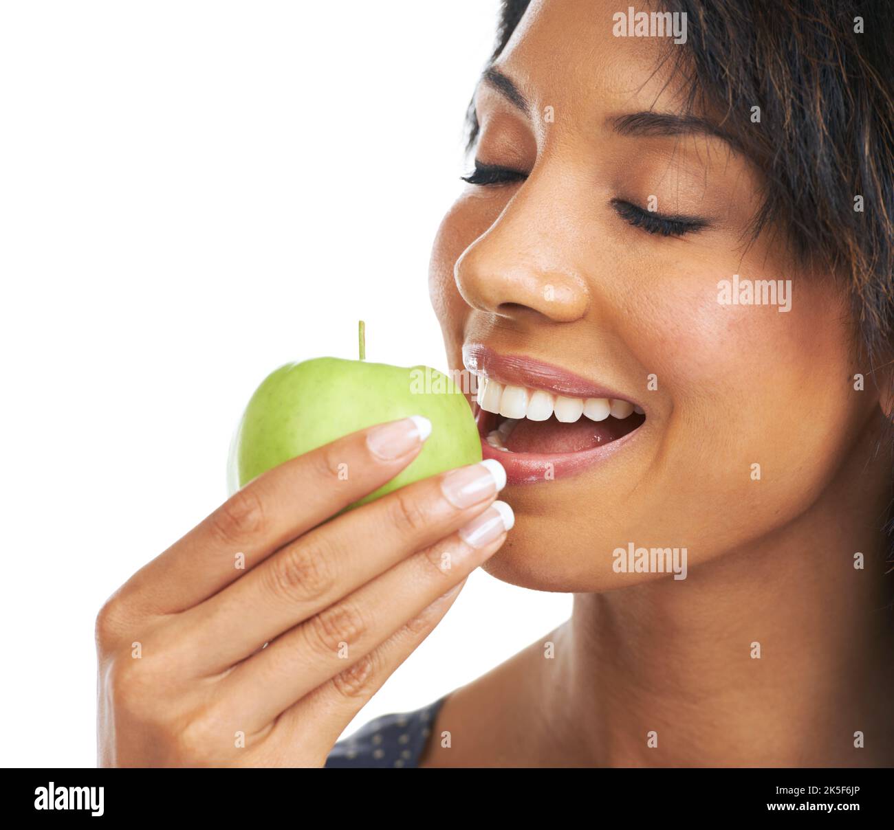 The moment before the first delicious bite. A pretty young woman biting ...