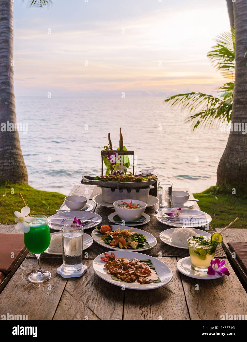Romantic dinner on the beach with Thai food during sunset on the Island ...