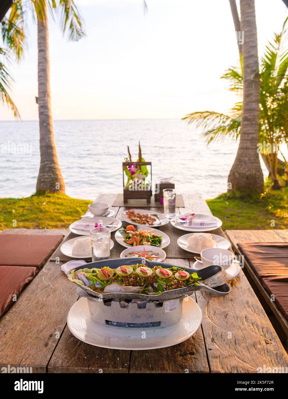 Romantic dinner on the beach with Thai food during sunset on the Island ...