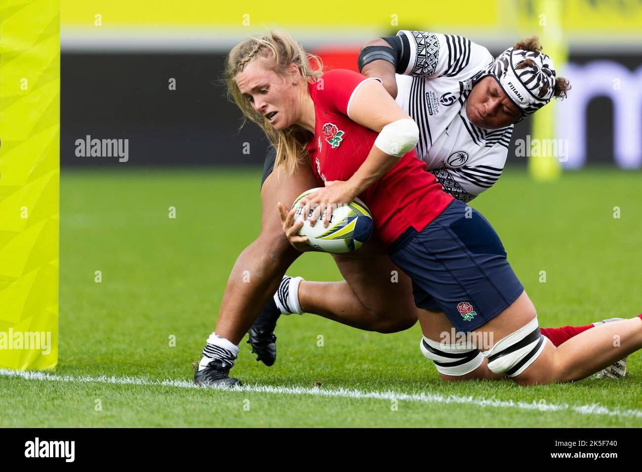 England's lock Zoe Aldcroft is held up over the try line by Fiji's Vika ...