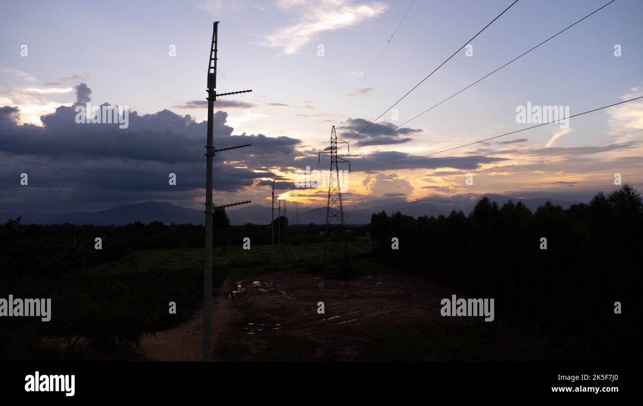Silhouette of electric pole at dusk. Electric poles and wires in the ...