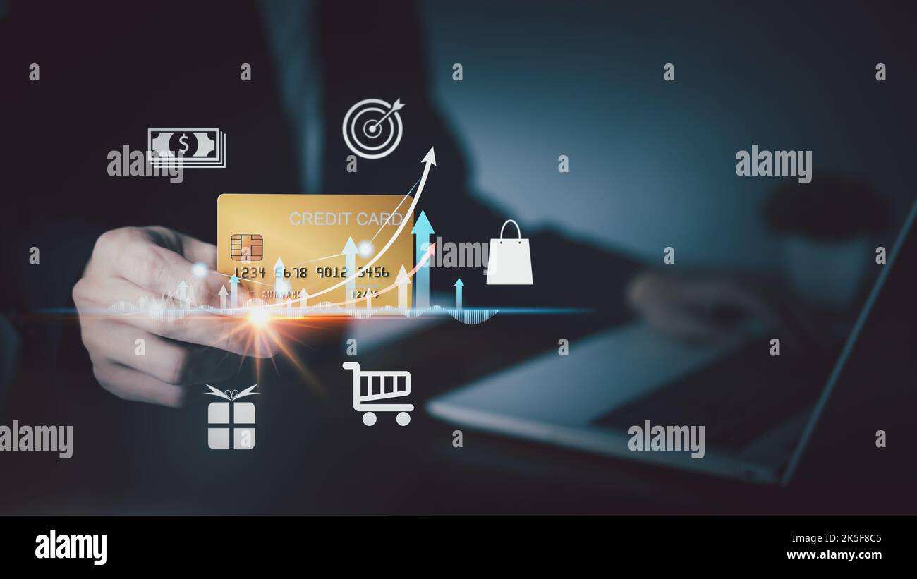 Online payment with credit card technology. Businessman hand hold gold ...