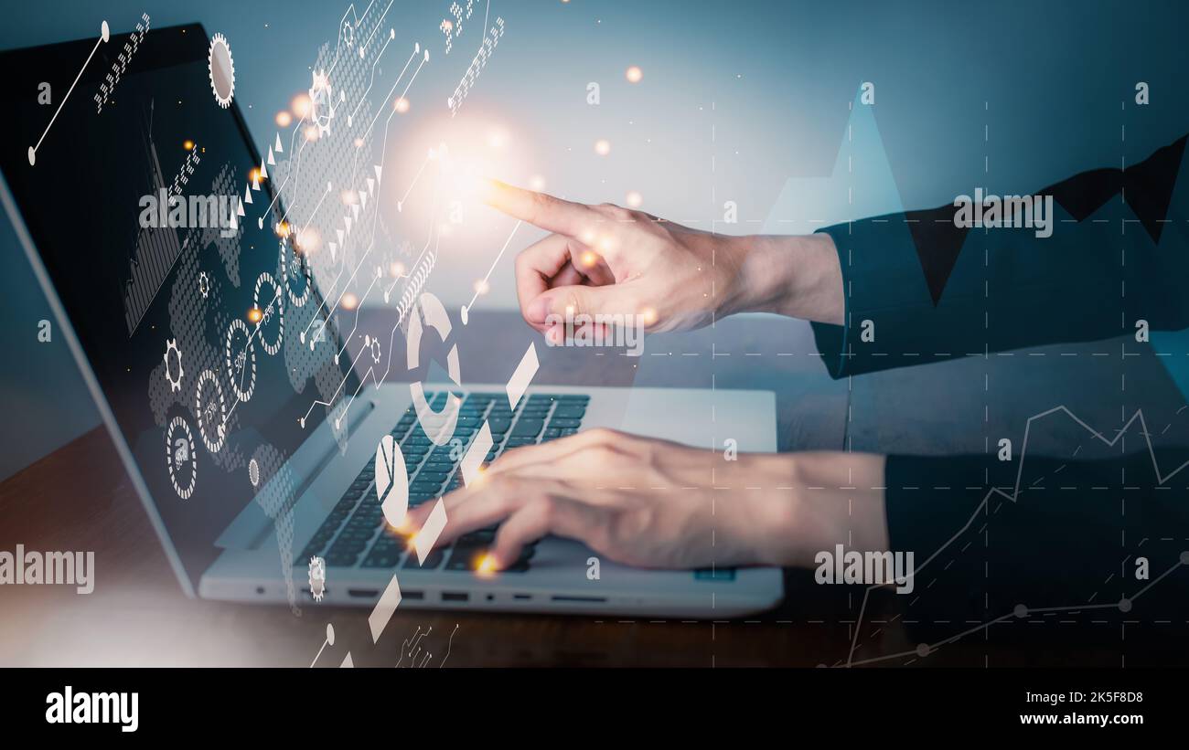 Success business concept. Businessman hand touch notebook (Laptop) with hologram of statistics ...