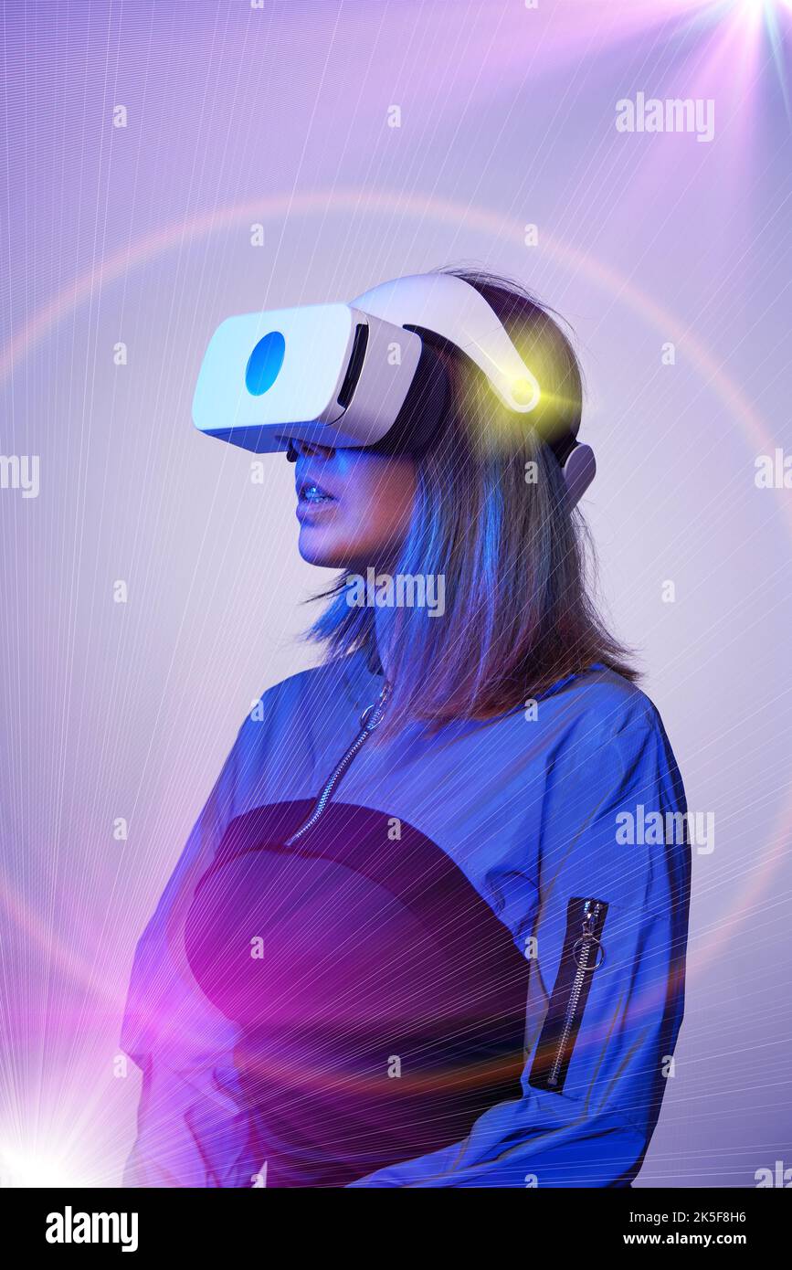 Woman is using virtual reality headset. Concept of virtual, augmented and extended reality ...