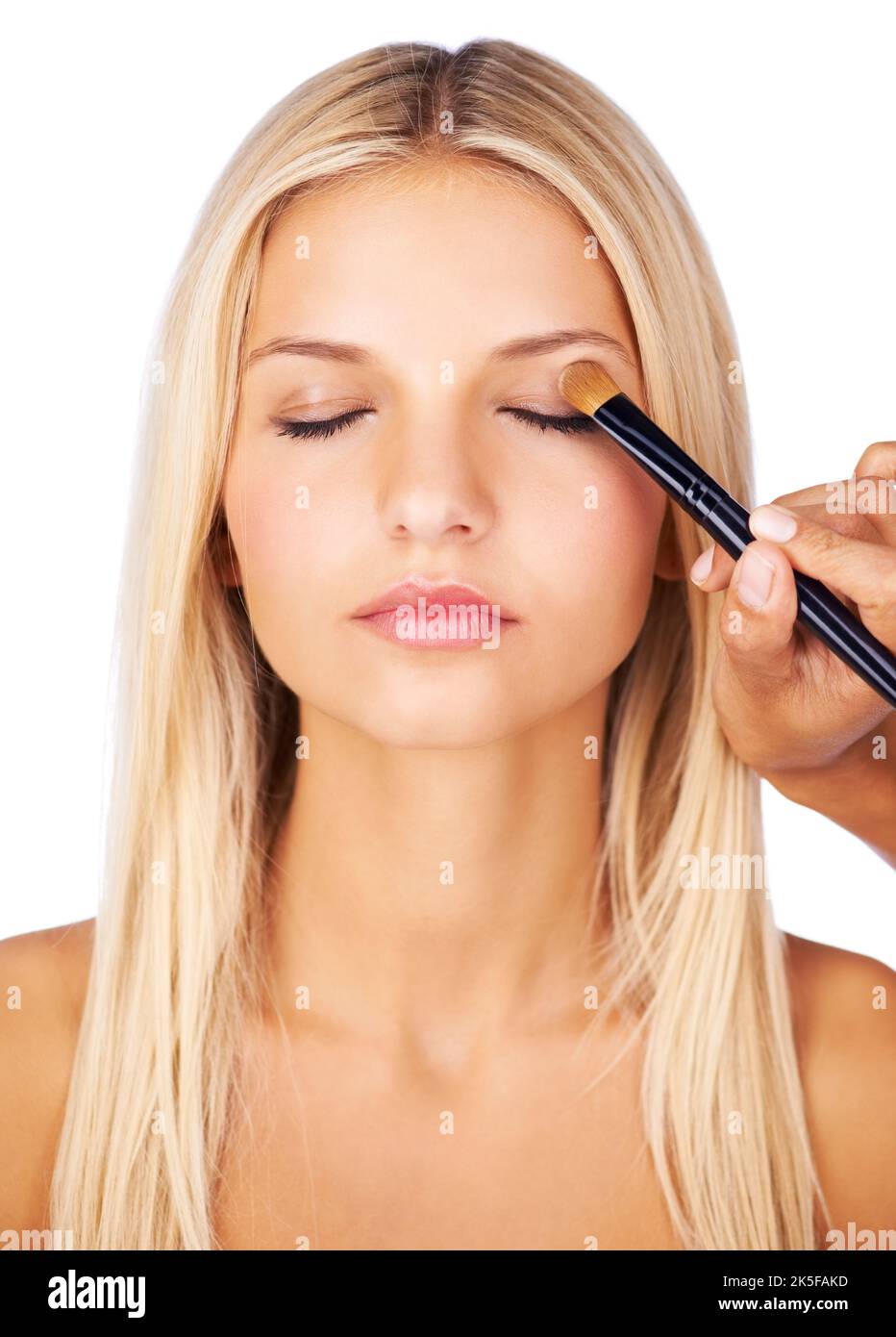 Choosing a shade to compliment her skin tone. Cropped view of a young ...