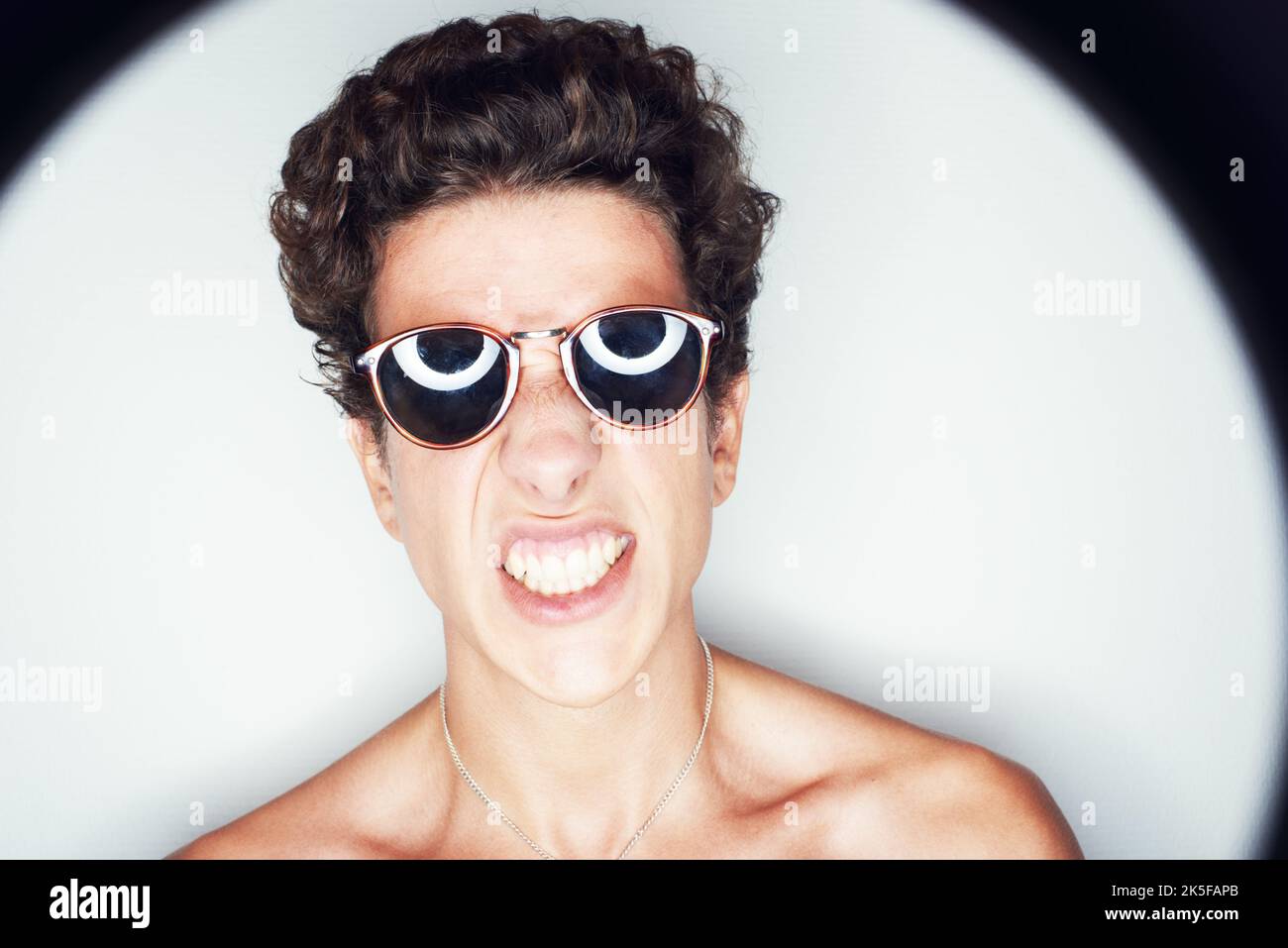 Party animal. Studio portrait of a young man wearing glasses and ...