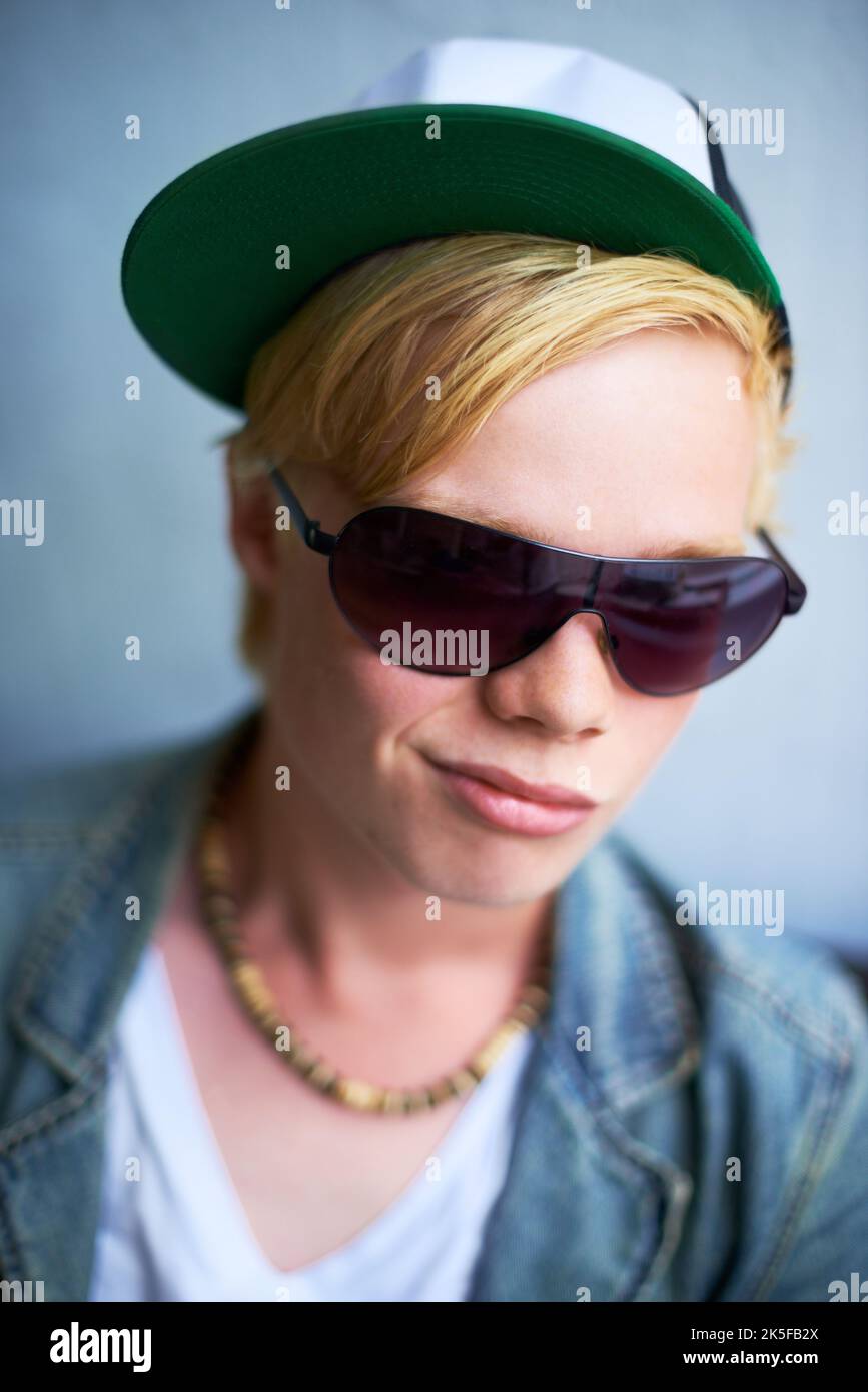 Street smart. Attractive young blond guy wearing street-style clothing ...