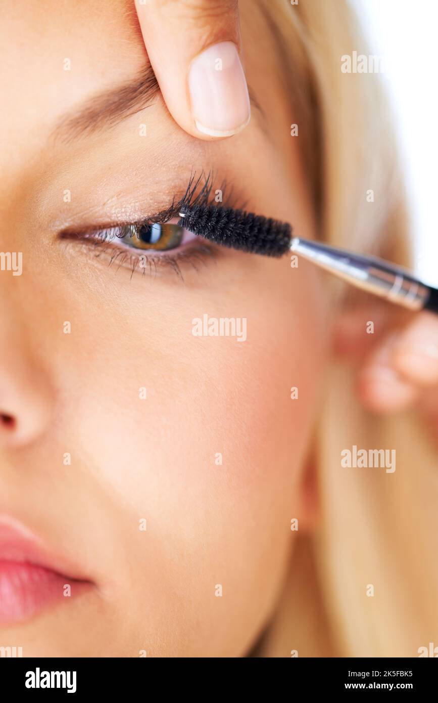 Creating volume and length. Cropped view of a young woman having ...