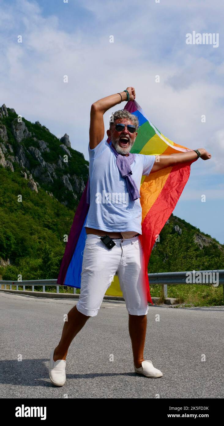 Portrait of a gray-haired senior elderly Caucasian man bisexuality with ...