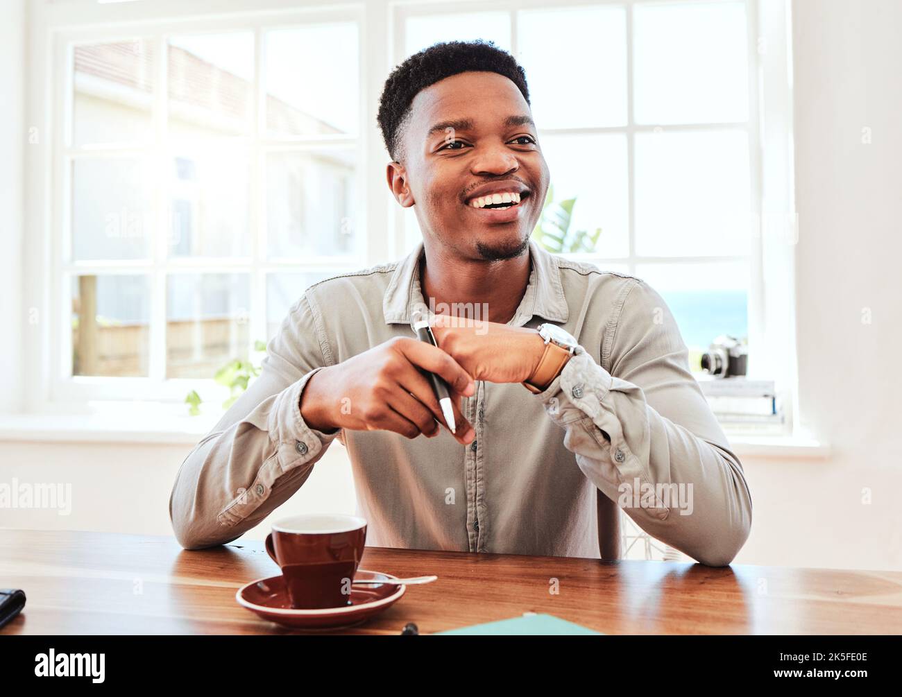 Black man, thinking and vision of company future and take notes or ...