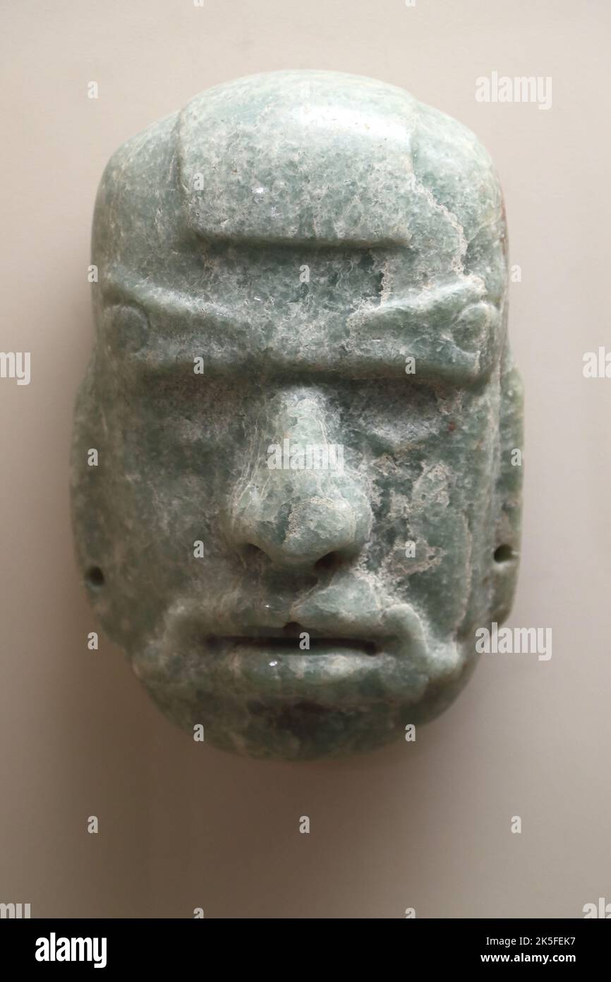 Jade mask of anthropomorphic god from the Maya civilization on display ...