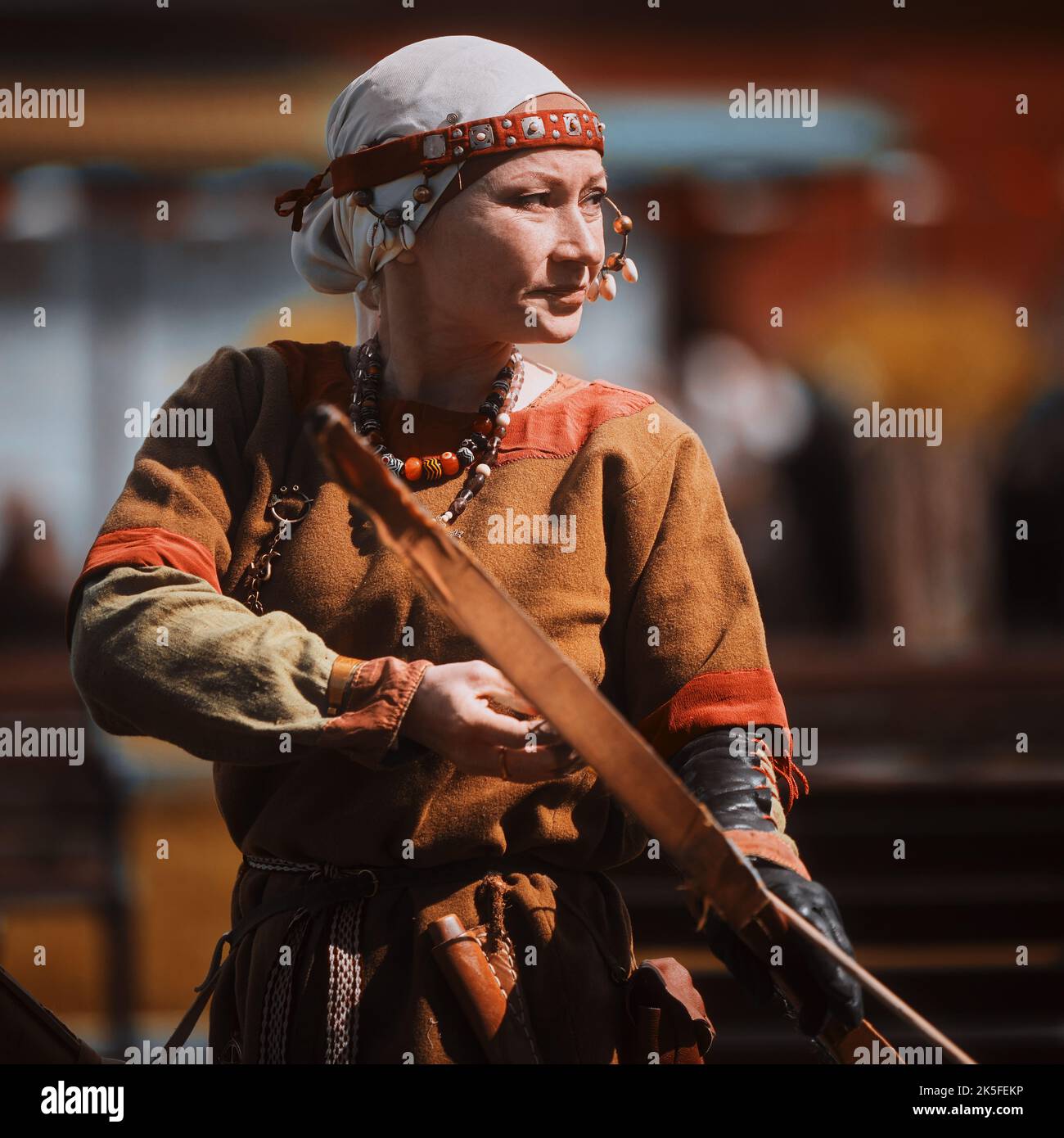 Medieval archery tournament. A woman shoots an arrow in the medieval ...