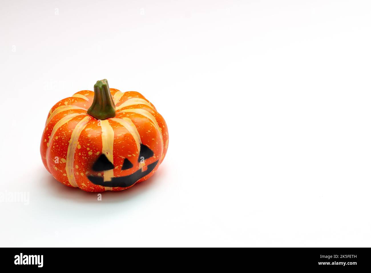 Halloween decorations concept, Scary smiling pumpkin on white ...