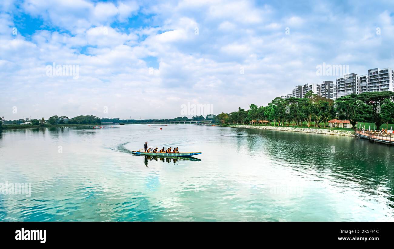 Dragon boat cruising at Lower Seletar Reservoir Park. It is a reservoir ...